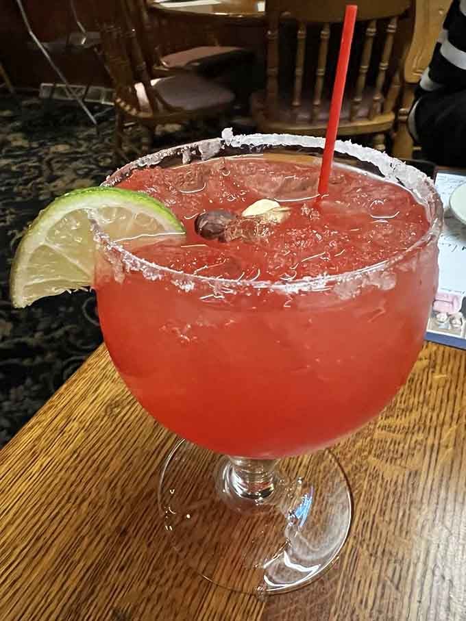 A strawberry daiquiri with a salt rim that's practically begging to be photographed before you take that first sip.