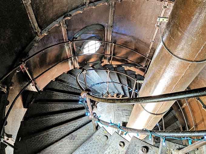 That spiral staircase inside is narrow, metal, and absolutely thrilling, like a time machine going straight up.