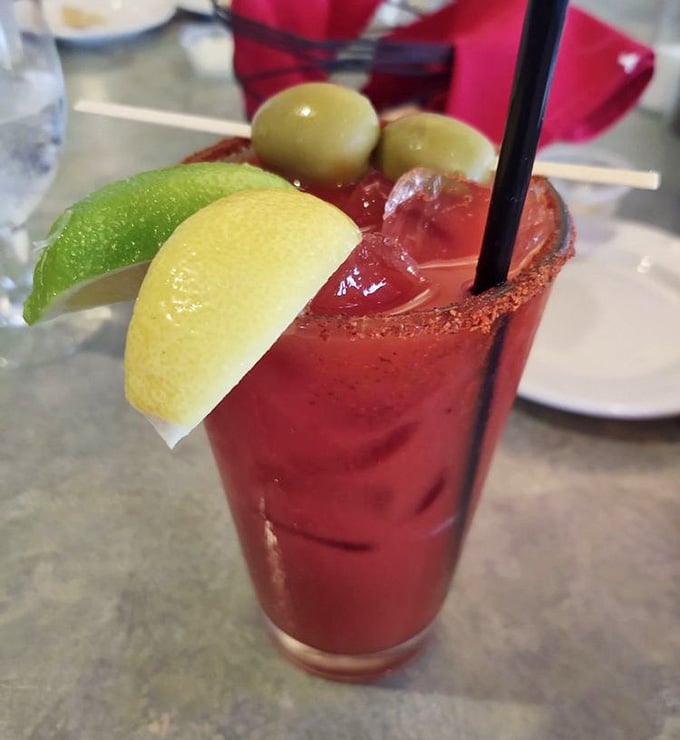 A Bloody Mary dressed to impress, with olives, citrus, and a spiced rim that means business.