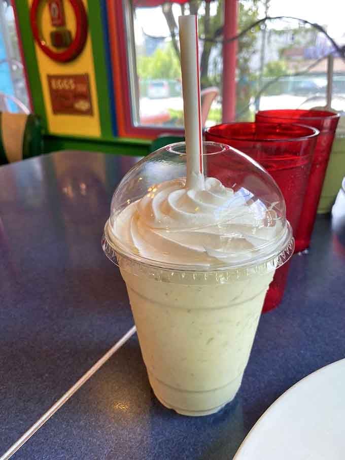 Pale green, topped with whipped cream, and served in a colorful dining room, this avocado milkshake is a conversation starter in a cup.