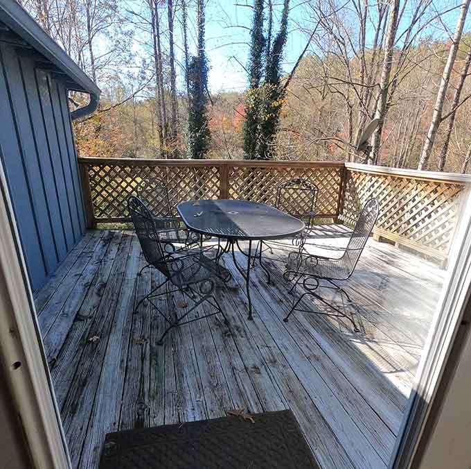 Wrought iron chairs, autumn color, and open sky. This deck is where good conversations go to become great ones.