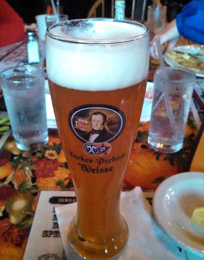 That perfect beer pour in a proper German glass suggests someone here takes their beverage service as seriously as grandma.