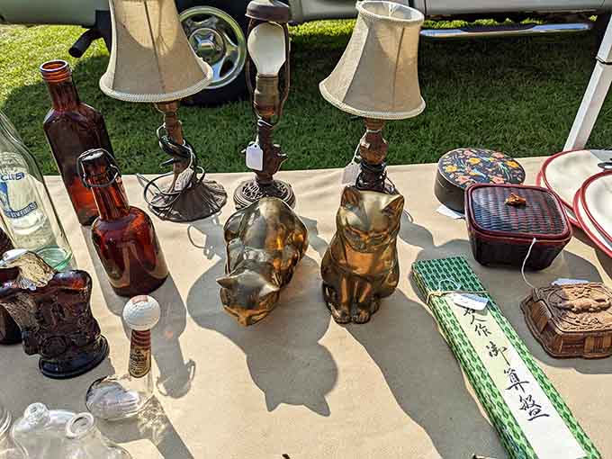 Brass cats, candlestick lamps, and amber bottles. Your living room called and it wants all of this immediately.