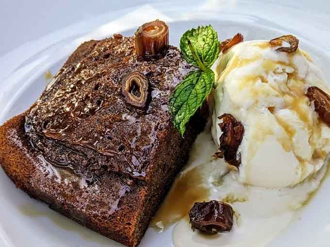 Sticky toffee cake with ice cream and caramel sauce. This dessert doesn't ask for your attention, it simply commands it.