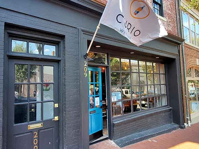 That bright blue door and boldly flying Curio Wine Bar flag say everything you need to know about what's waiting inside.