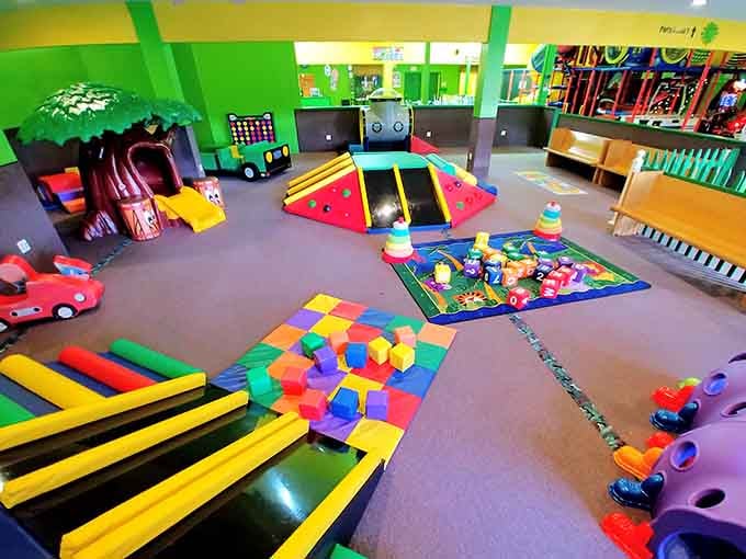 Rainbow explosion of play equipment that looks like Willy Wonka designed a children's paradise, minus the Oompa Loompas.