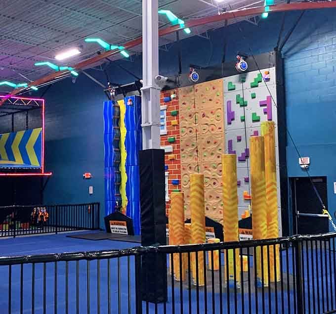 Colorful climbing holds, padded columns, and a wall that begs to be conquered, the climbing area means business here.