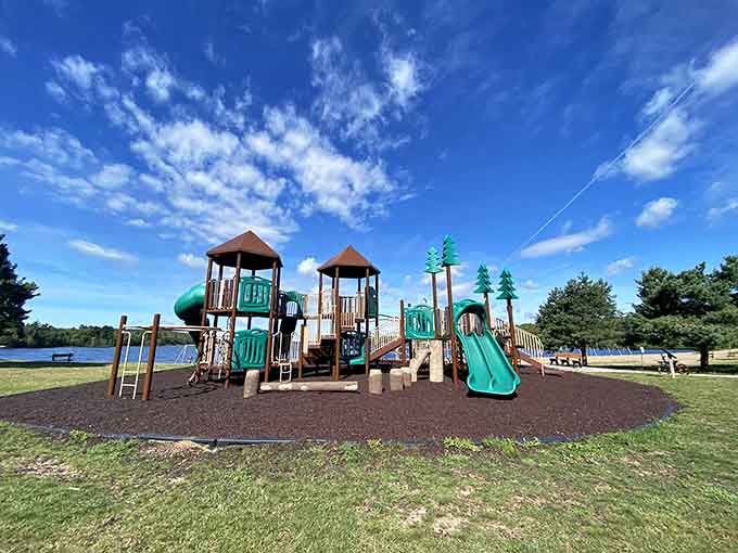 The playground overlooks the lake because even kids deserve million-dollar views while they're busy being kids and having fun.