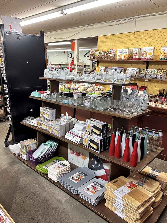 Cutting boards, glassware, and butter dishes lined up together like a very well-stocked kitchen waiting to happen.