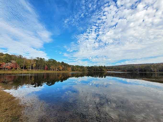 On a clear autumn day, this lake reflects the sky so perfectly it looks like the world flipped upside down.