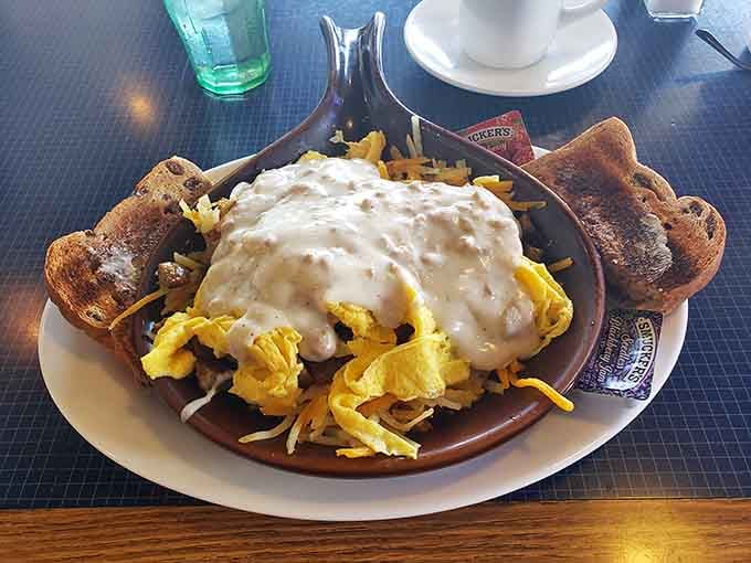 A sausage gravy skillet that arrives looking like a warm, edible hug. Toast on the side, no complaints here.