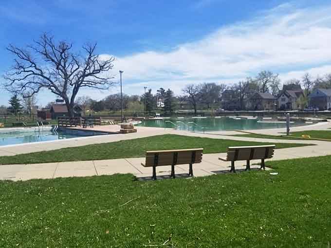 Two empty benches patiently waiting for someone to sit down, slow down, and actually enjoy a Tuesday afternoon.