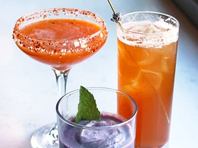 Three cocktails walk into a brunch spot, the spicy rim, the lavender garnish, and the mint sprig win.