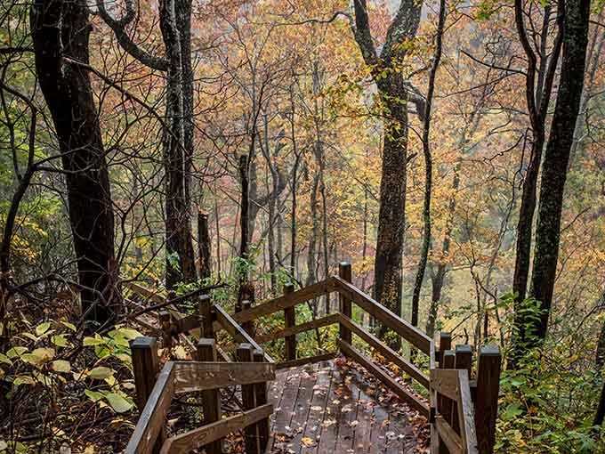 Fall foliage plus wooden staircases plus a 411-foot waterfall equals a scene that belongs on a postcard.
