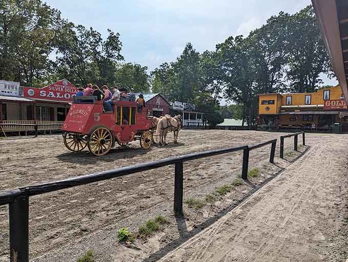 Stagecoach number five making its rounds, horses steady, passengers grinning from ear to ear.
