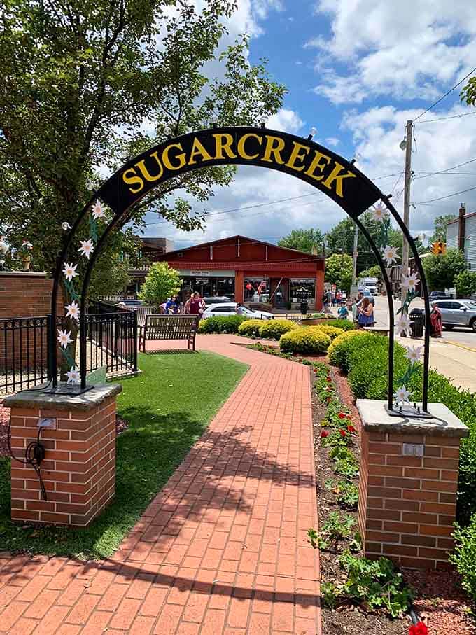 The Sugarcreek archway welcomes you like a handshake from a town that's genuinely glad you showed up.