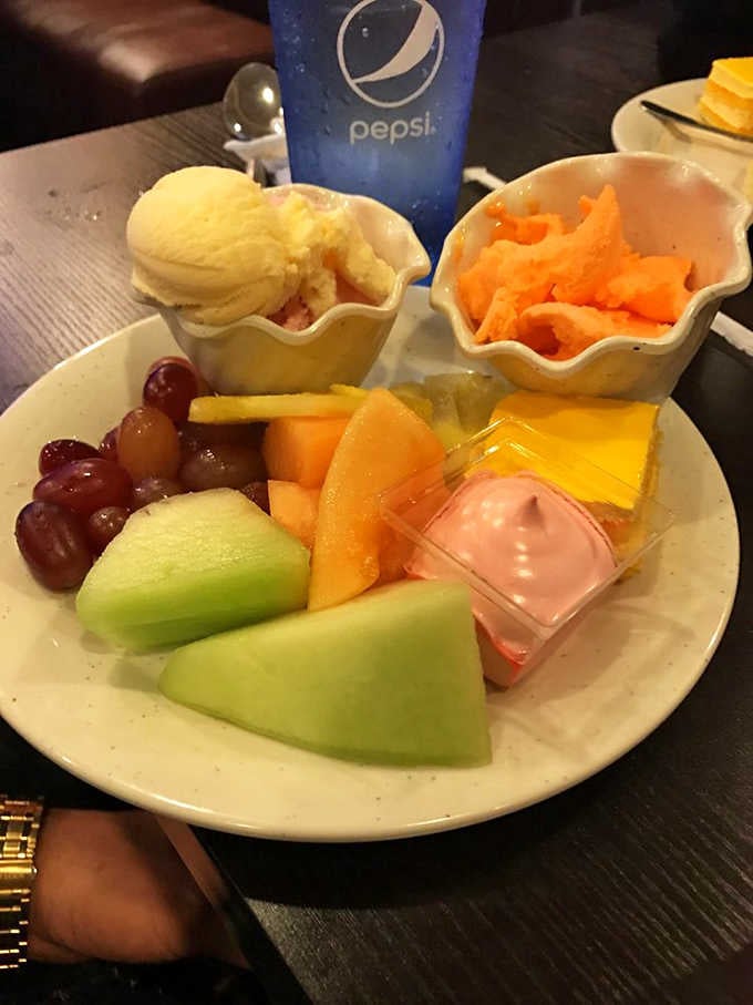 Ice cream, fresh melon, grapes, and little dessert bites. The sweetest ending to a very satisfying meal.