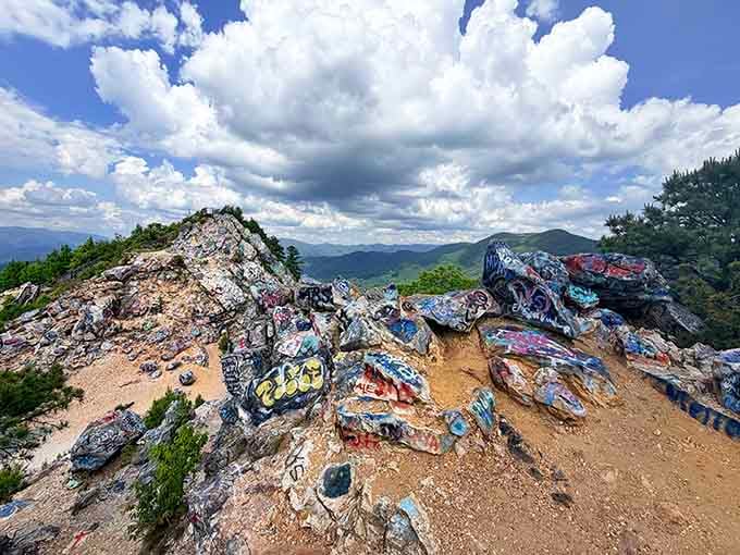 Painted rocks cover the summit in a riot of colors that would make Jackson Pollock nod with approval.