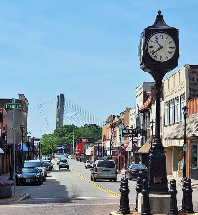 Cape Girardeau's elegant street clock stands guard on Themis Street, with the Bill Emerson Bridge rising majestically in the background.