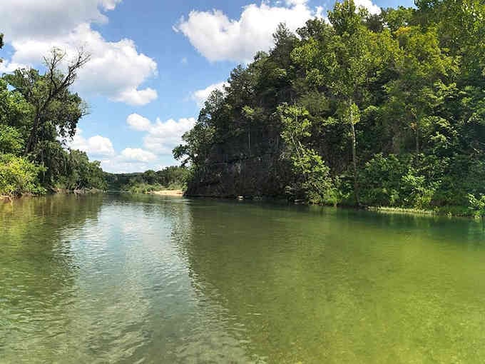 Crystal clear waters wind through green forests like liquid emerald searching for the nearest swimming hole.
