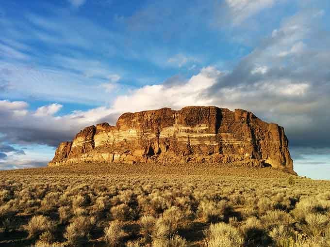This volcanic fortress stands alone on the high desert plain, commanding the horizon like an ancient sentinel.