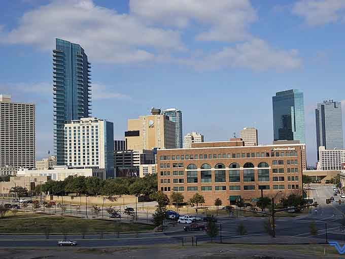 Fort Worth's glittering skyline rises confidently against a crisp blue sky, proof that this city has absolutely nothing to prove.