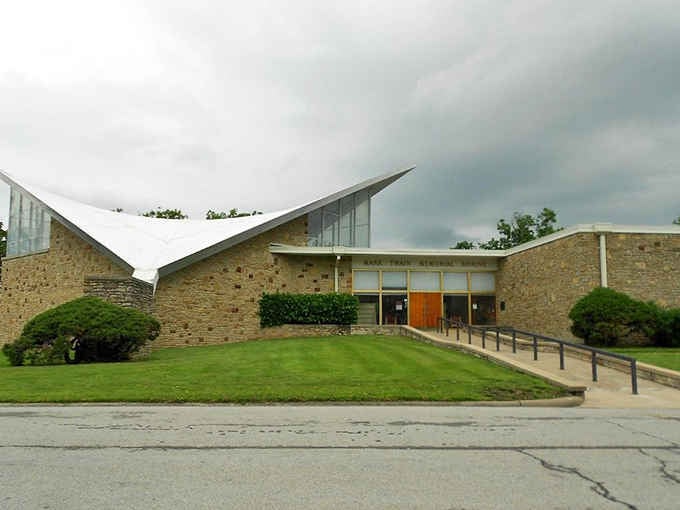That dramatic angular roofline against a stormy sky makes the Mark Twain Birthplace museum look like literature itself took architectural form.