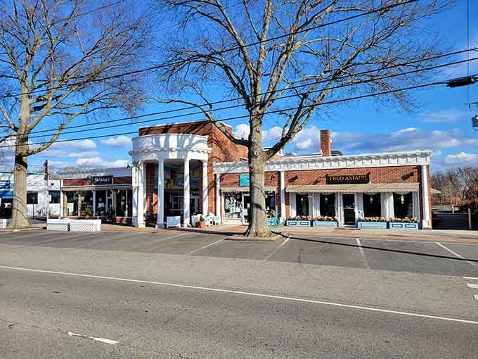 Bare winter trees and bright white storefronts give Old Saybrook's main street a clean, no-nonsense beauty that feels refreshingly honest.