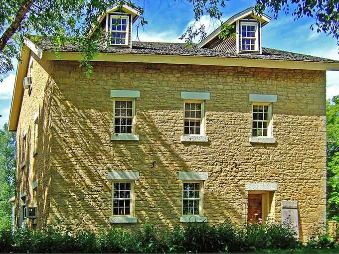 Paoli's gorgeous old limestone mill building glows warmly in dappled summer light, looking like it was placed there by someone with excellent taste.