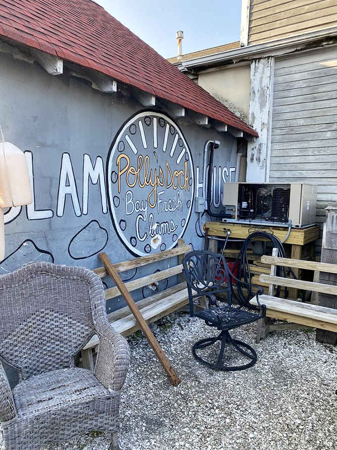 Hand-lettered "Bay Fresh Clams" painted on a gray wall surrounded by mismatched chairs captures the wonderfully unpolished soul of this place.