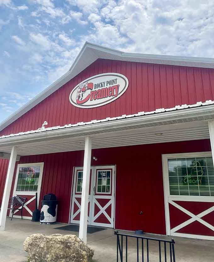 Rocky Point Creamery's bold red barn facade against a dramatic cloudy sky looks like a painting you'd want to eat inside.