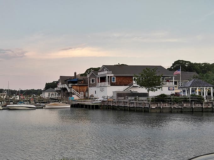 Shelter Island's waterfront homes catch the evening light, where boats bob gently and worries drift away with the tide.