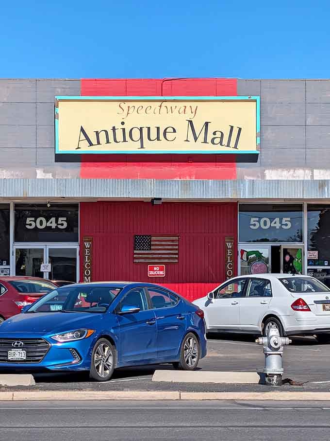 The bold red and turquoise signage pops against gray walls, making this treasure trove impossible to miss from the street.