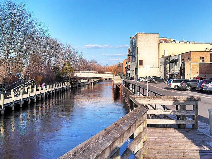 Traverse City's Boardman River boardwalk catches the last golden light of a winter afternoon, quiet and completely gorgeous.