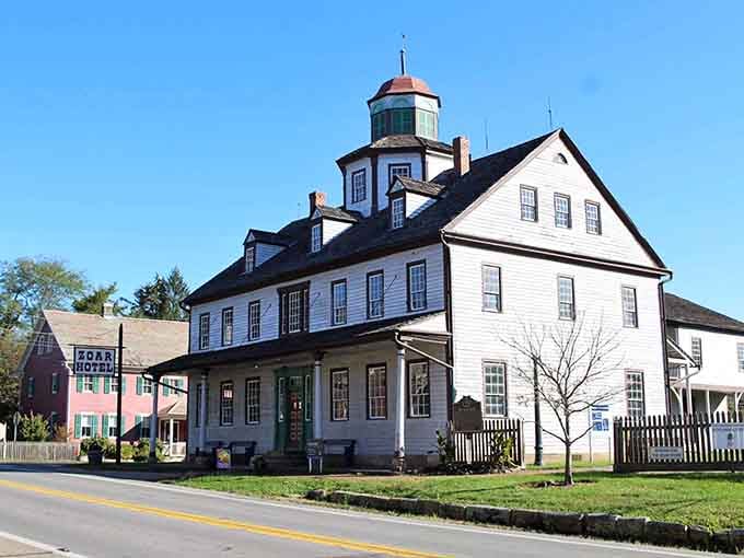 Zoar's grand Number One House stands beneath a brilliant blue sky, its cupola watching over the village like a proud sentinel.