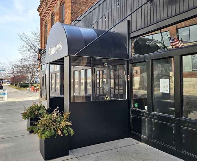 A sleek black awning and elegant script lettering give Andrews' entrance a quiet confidence that needs absolutely no explanation.