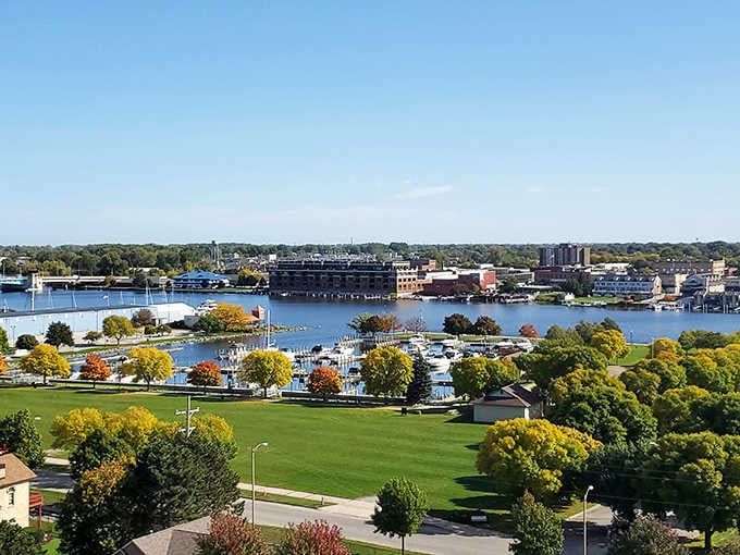 Bay City's marina glows in autumn splendor, sailboats resting quietly on the Saginaw River while golden trees frame the waterfront like a masterpiece.