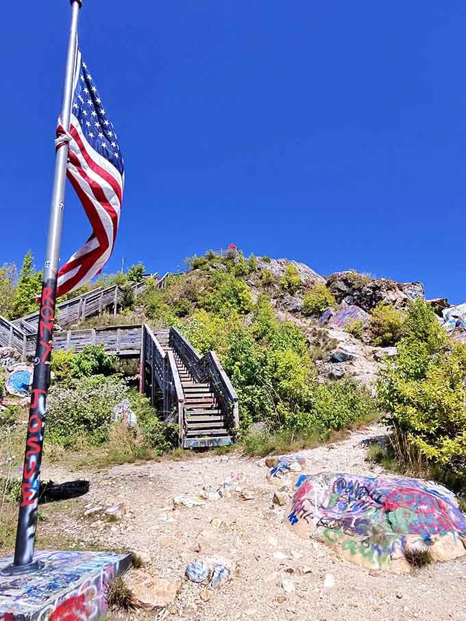 The flag-adorned trail leads upward to mountain views and artistic expression that's uniquely American and wonderfully weird.