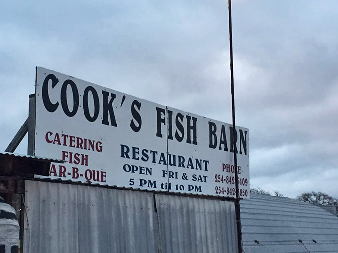A big bold sign, a metal roof, and two phone numbers &mdash; Cook's Fish Barn keeps it simple and lets the food do the talking.