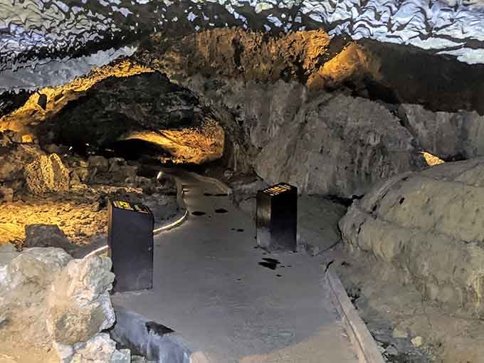 Golden light dances across volcanic walls where shadows and stone tell stories thousands of years old.