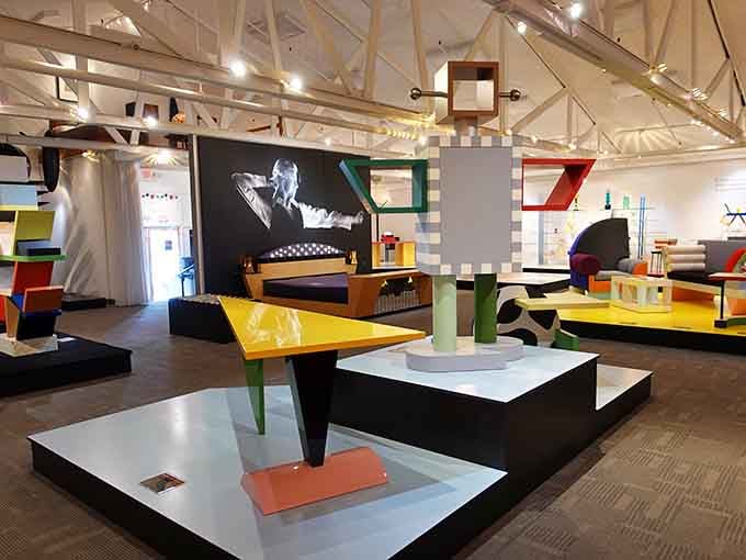 Geometric furniture in every color of the rainbow fills this room, proof that the 1980s Memphis Design movement never met a rule it liked.