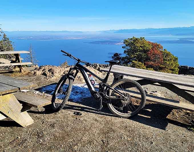 That mountain bike earned its rest with panoramic island views stretching clear to the horizon as reward.
