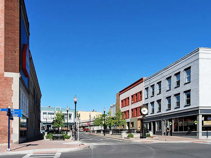 Plattsburgh's downtown street clock stands at attention under a flawless blue sky, keeping perfect time in a perfectly charming city.