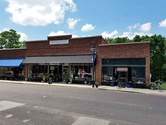 Granny's Antiques and Gifts sits beneath the Bysfield building sign in full summer sunshine, practically daring you not to stop and browse inside.