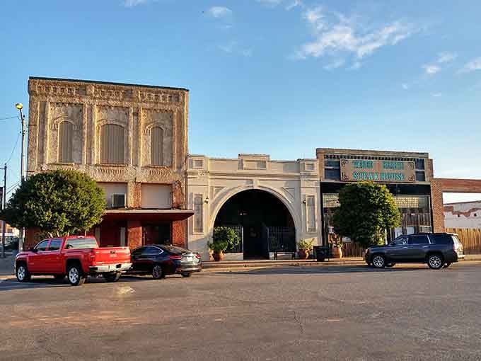 The golden hour hits Vernon's downtown just right, warming the ornate arched entrance of what appears to be a steakhouse worth finding.