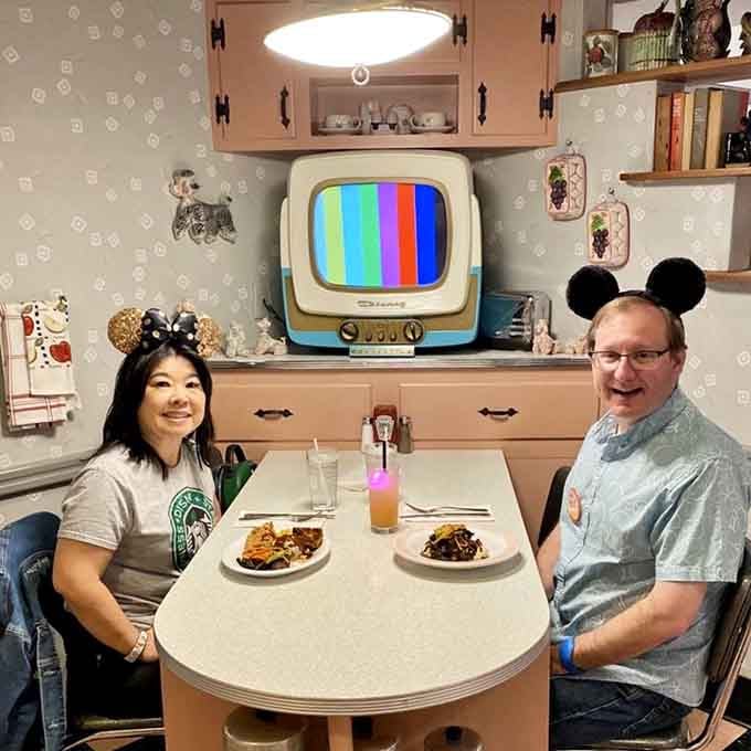 Two people, one formica table, and a vintage television. This is what a genuinely good evening looks like.