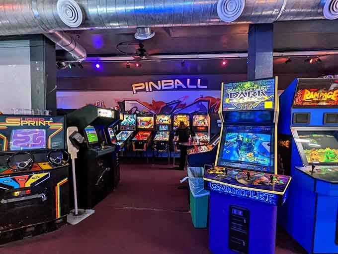 Classic upright cabinets shoulder to shoulder, including Gauntlet Dark Legacy and Rampage, ready for challengers.