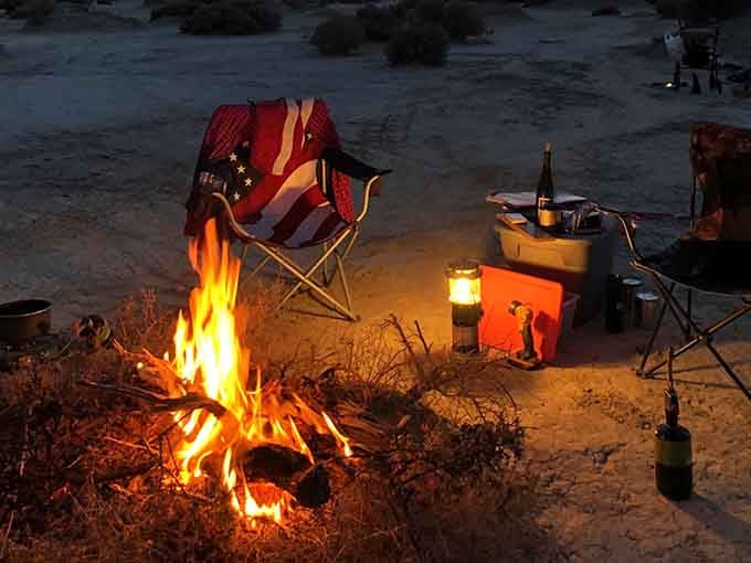 Campfire crackles under desert stars while your folding chair becomes the best seat you've occupied all year, bar none.