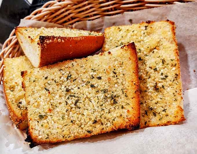 Garlic bread this golden and herb-crusted deserves its own fan club, possibly its own national holiday.
