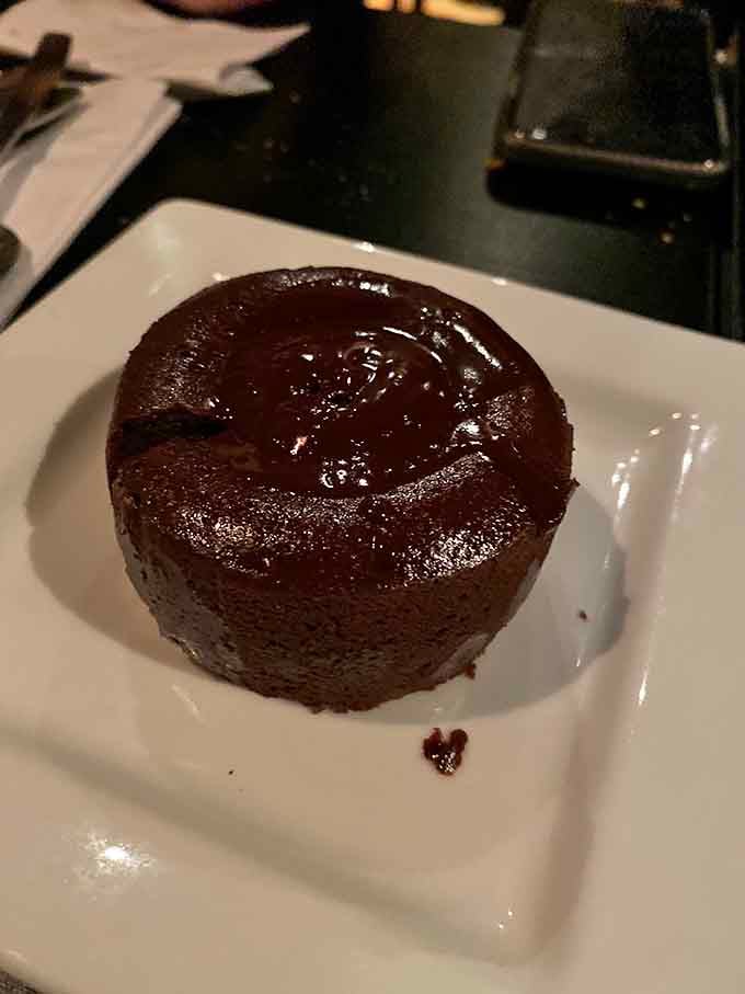 A chocolate lava cake so glossy and serious-looking, it deserves its own dramatic entrance music.